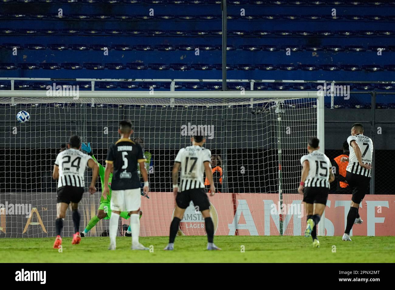Oscar Cardozo of Paraguay's Libertad, right, scores from the penalty ...