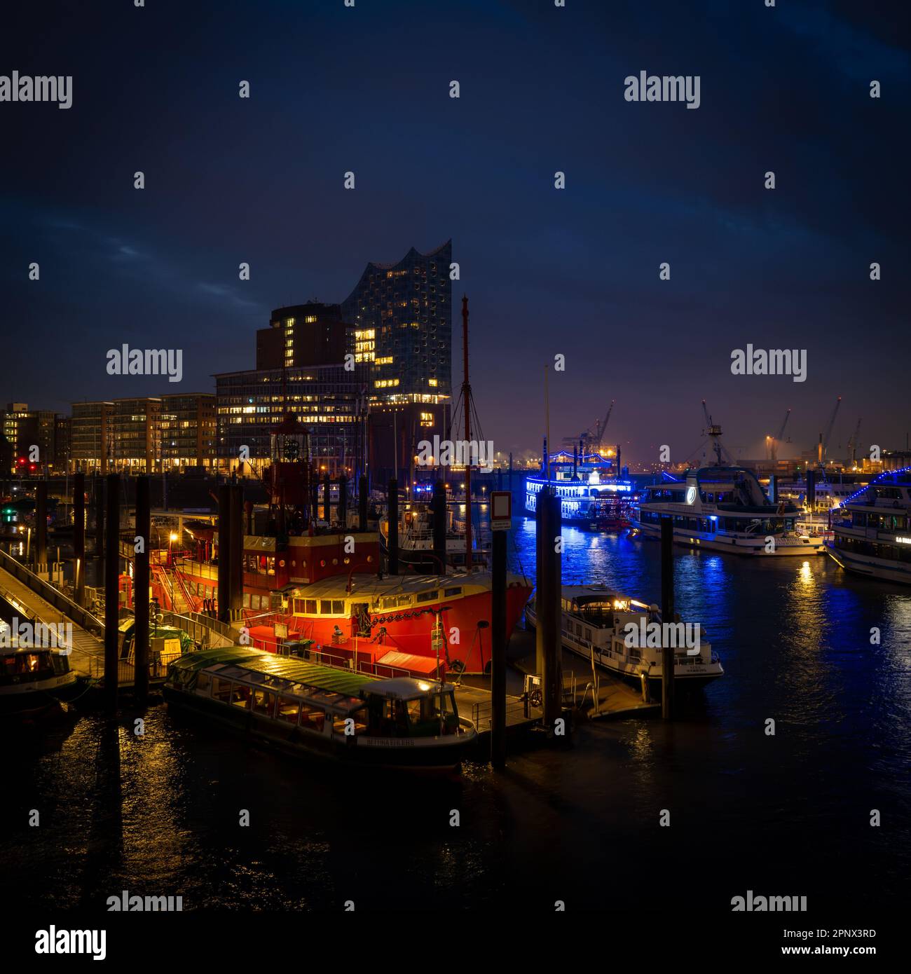The illuminated port of Hamburg at night Stock Photo - Alamy