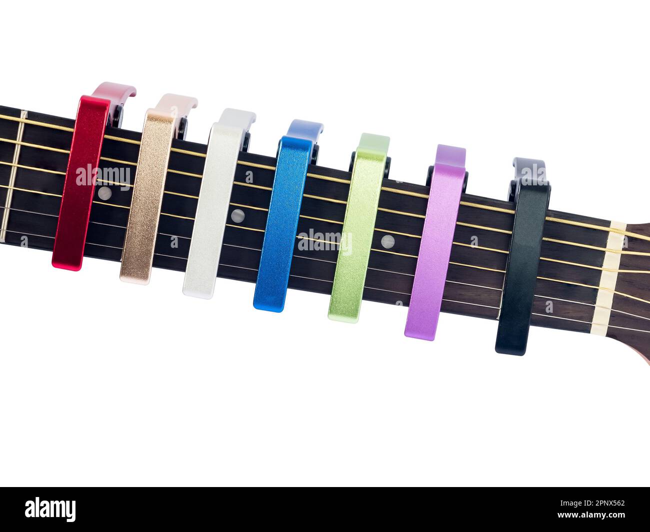 Colorful capo on guitar fingerboard, white background , close up Stock ...