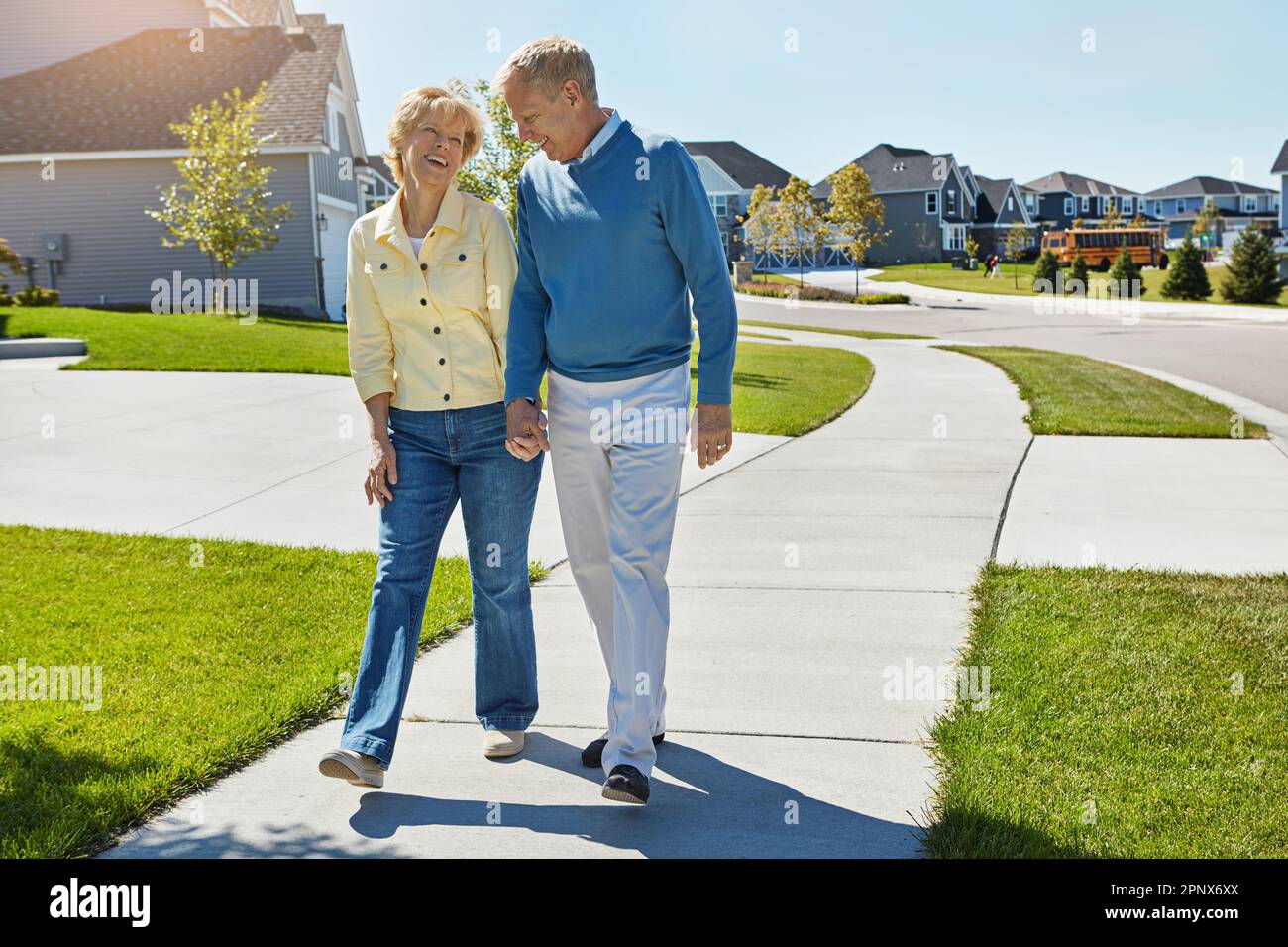 Its a beautiful day to be outside. a happy senior couple waking around ...