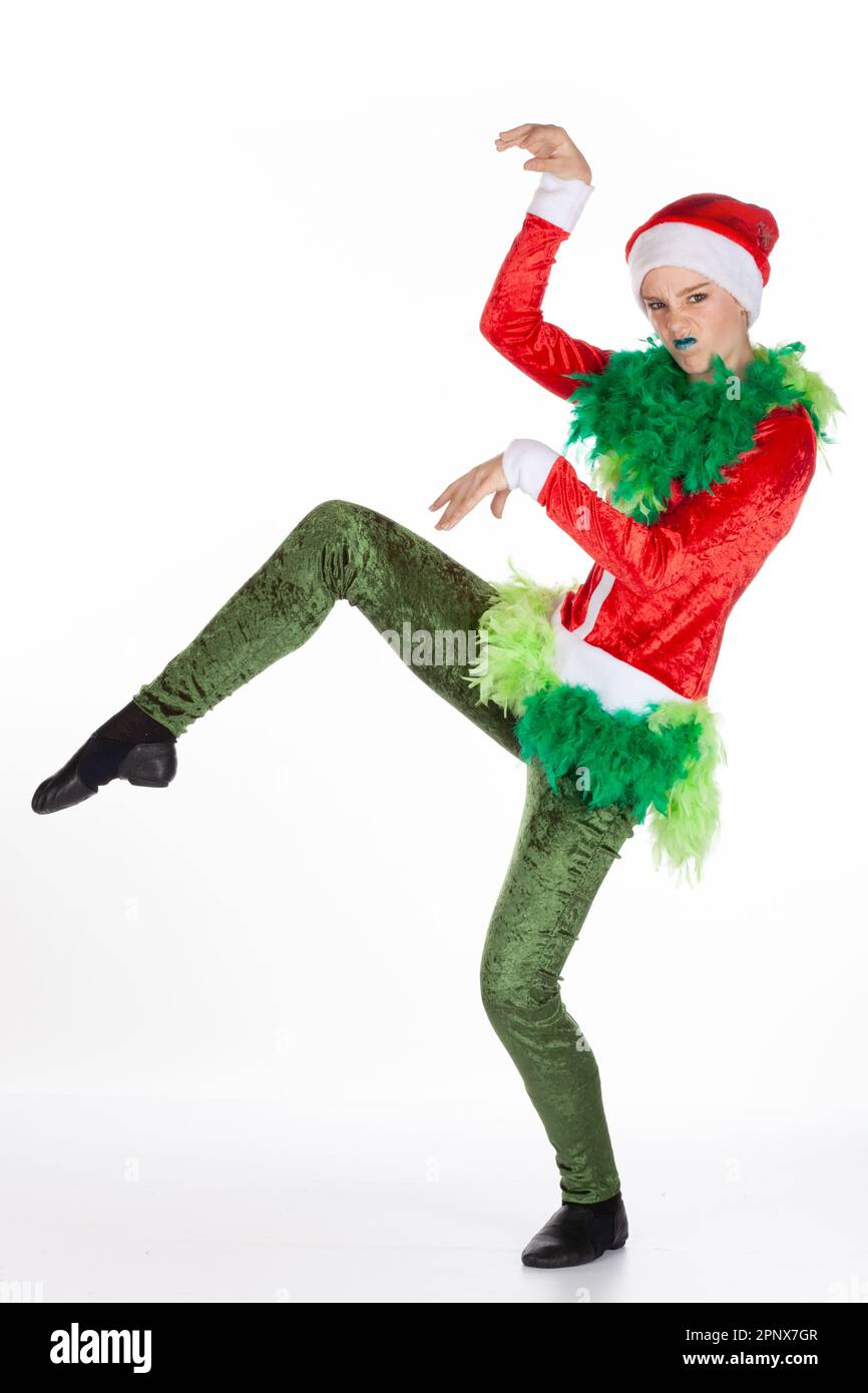 Young girl wearing red santa clause hat, Christmas grinch in stalking ...