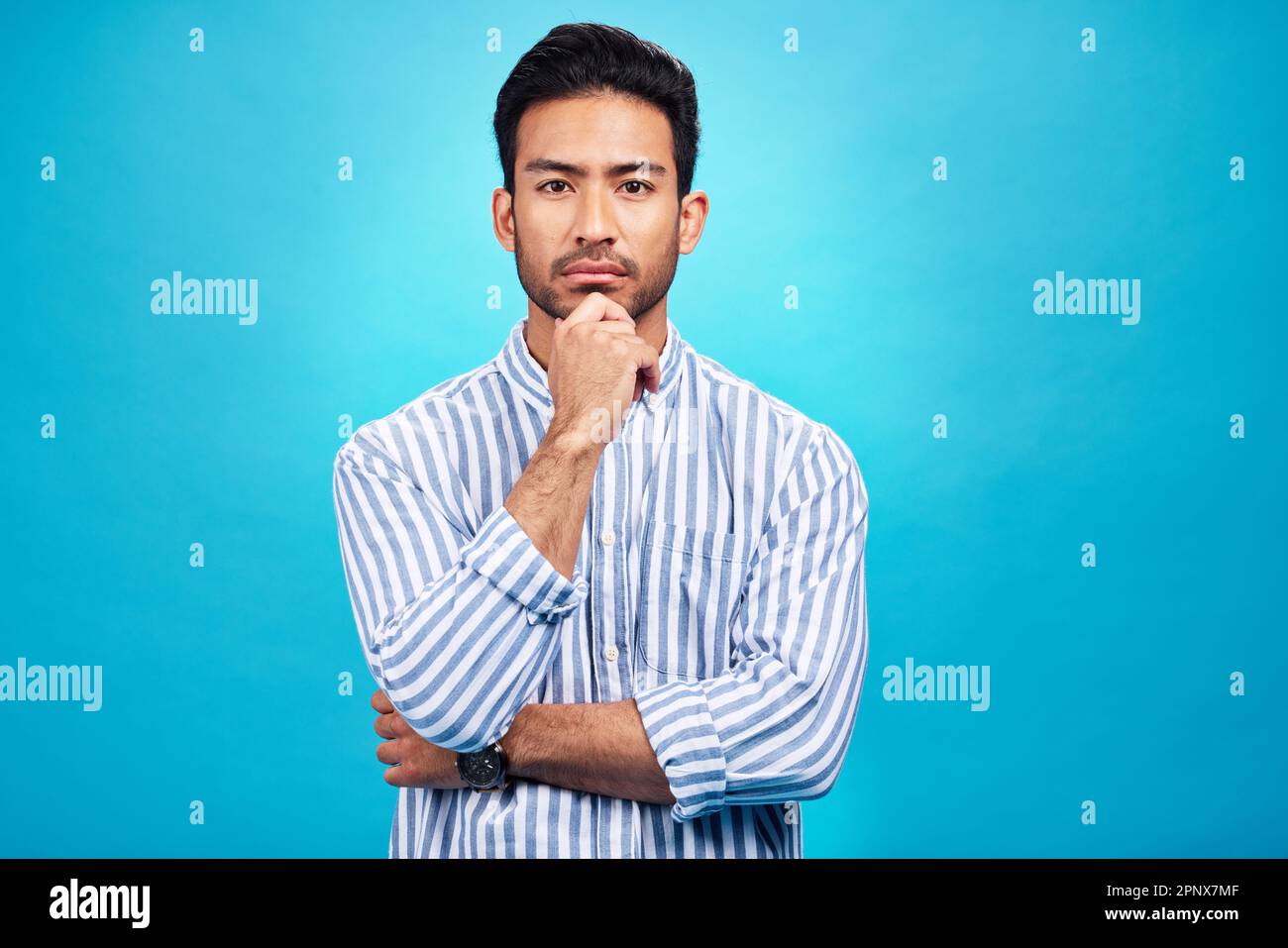 Portrait of man with focus, blue background and thinking of ideas with ...