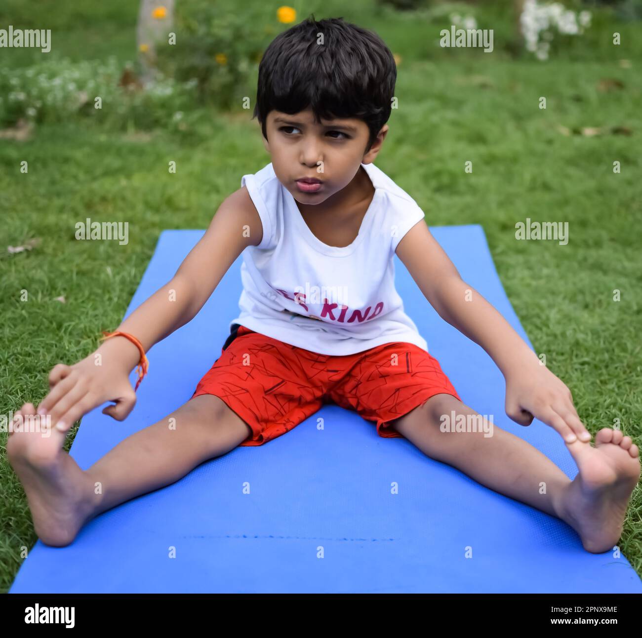 Asian smart kid doing yoga pose in the society park outdoor, Children's ...