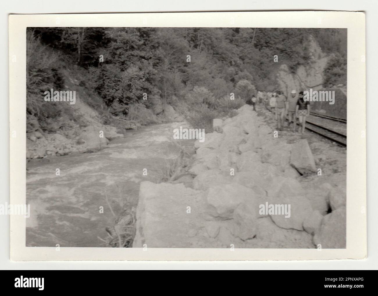 Vintage photo shows young canoeists go along the river Stock Photo - Alamy