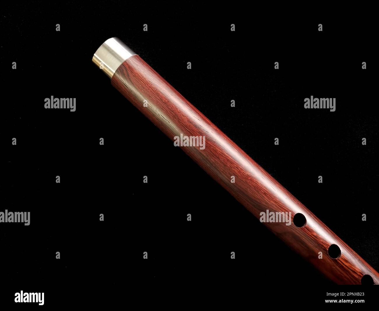 Close up shot of Thai flute. Flute made from siam rosewood with ...