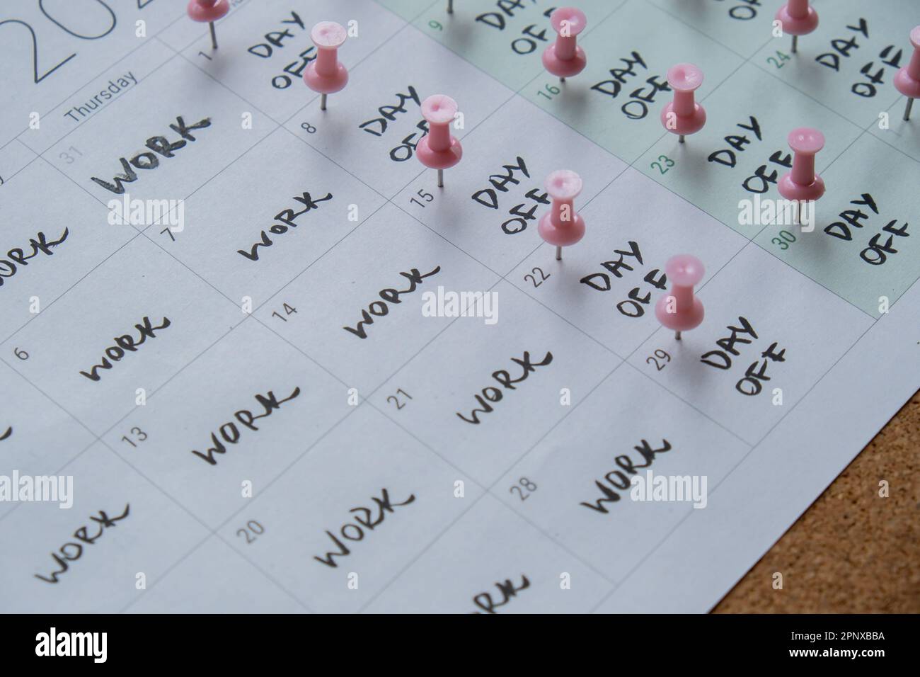 4 day work week printed calendar with pink pins on three days off in week weekend days four day ...