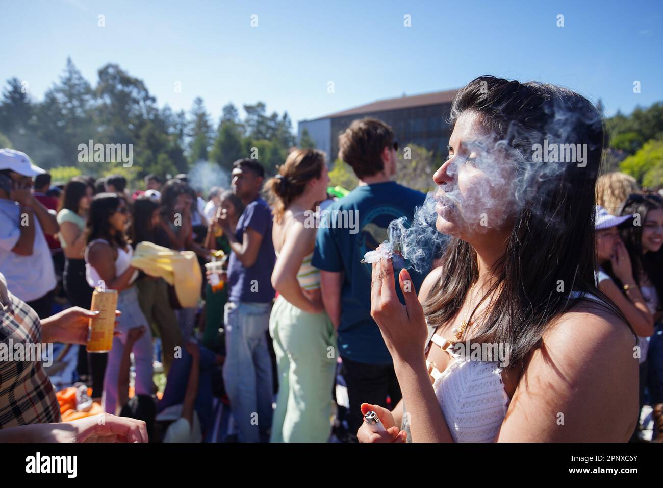 Berkeley, United States. 20th Apr, 2023. A girl smokes a joint during ...