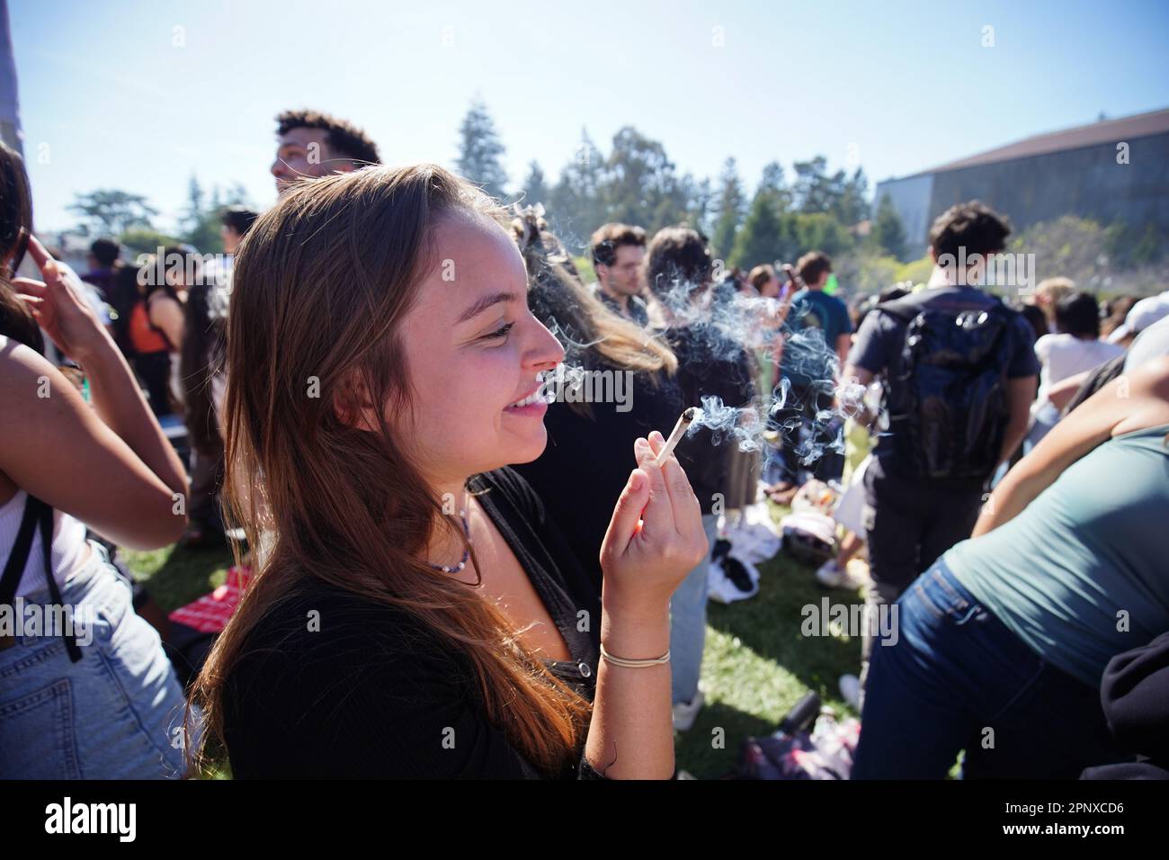 Berkeley, United States. 20th Apr, 2023. A girl smokes a joint during ...