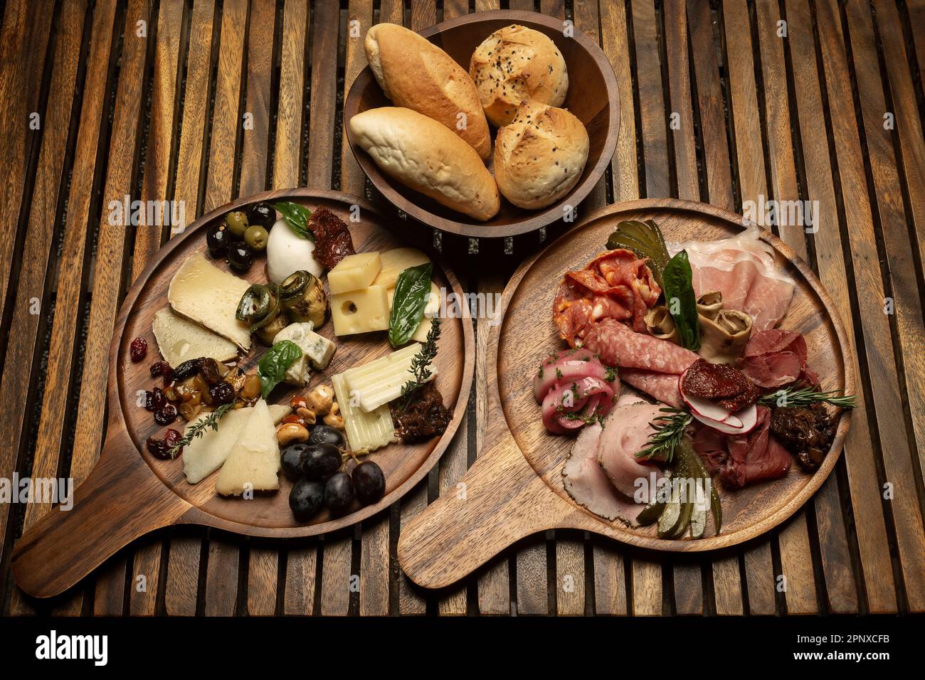 mixed european charcuterie and cheese cold cuts platter on wood table ...