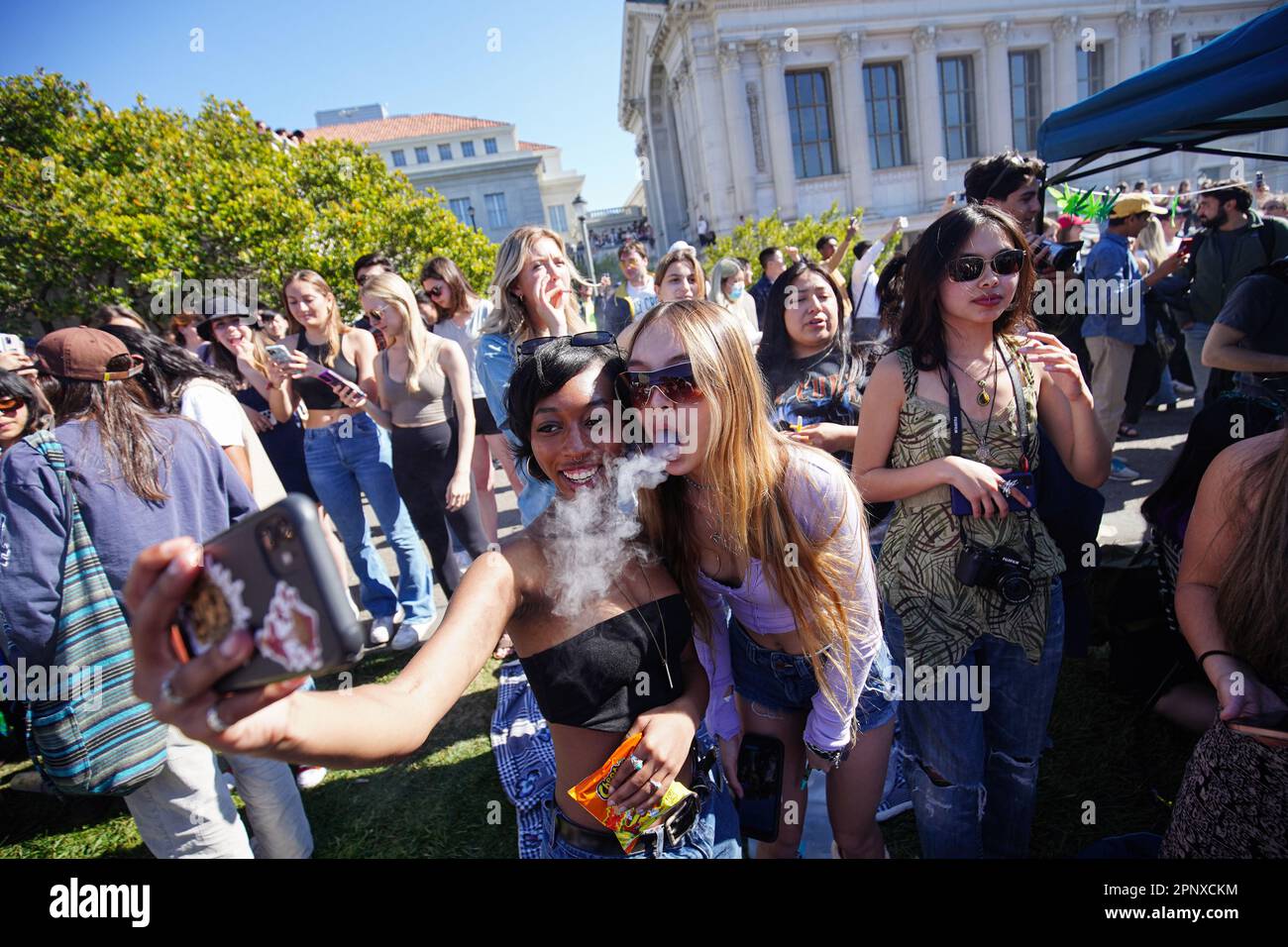 Berkeley, United States. 20th Apr, 2023. People smoke joints during the ...