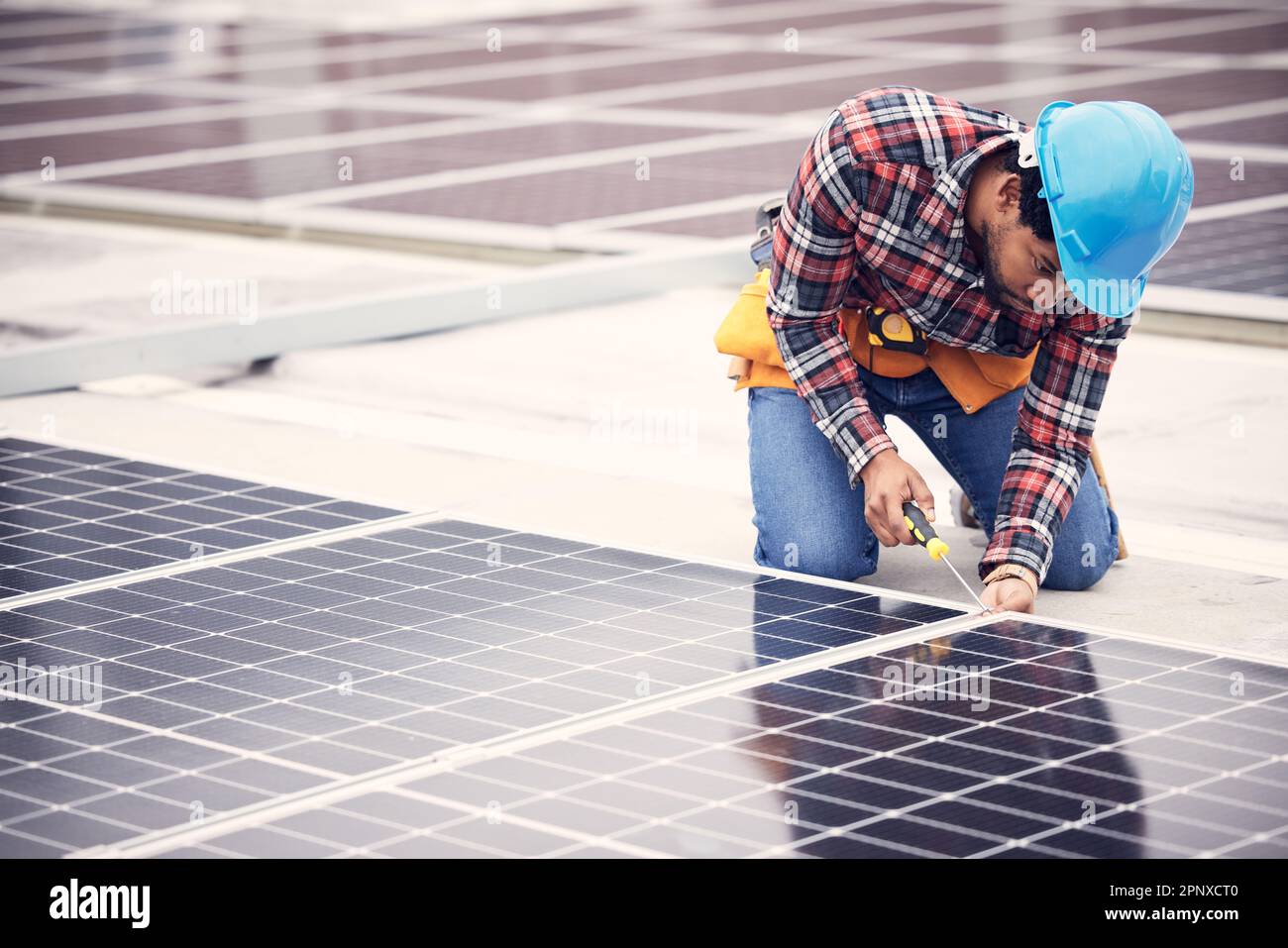 Black man, electrician and solar panels installation on rooftop ...