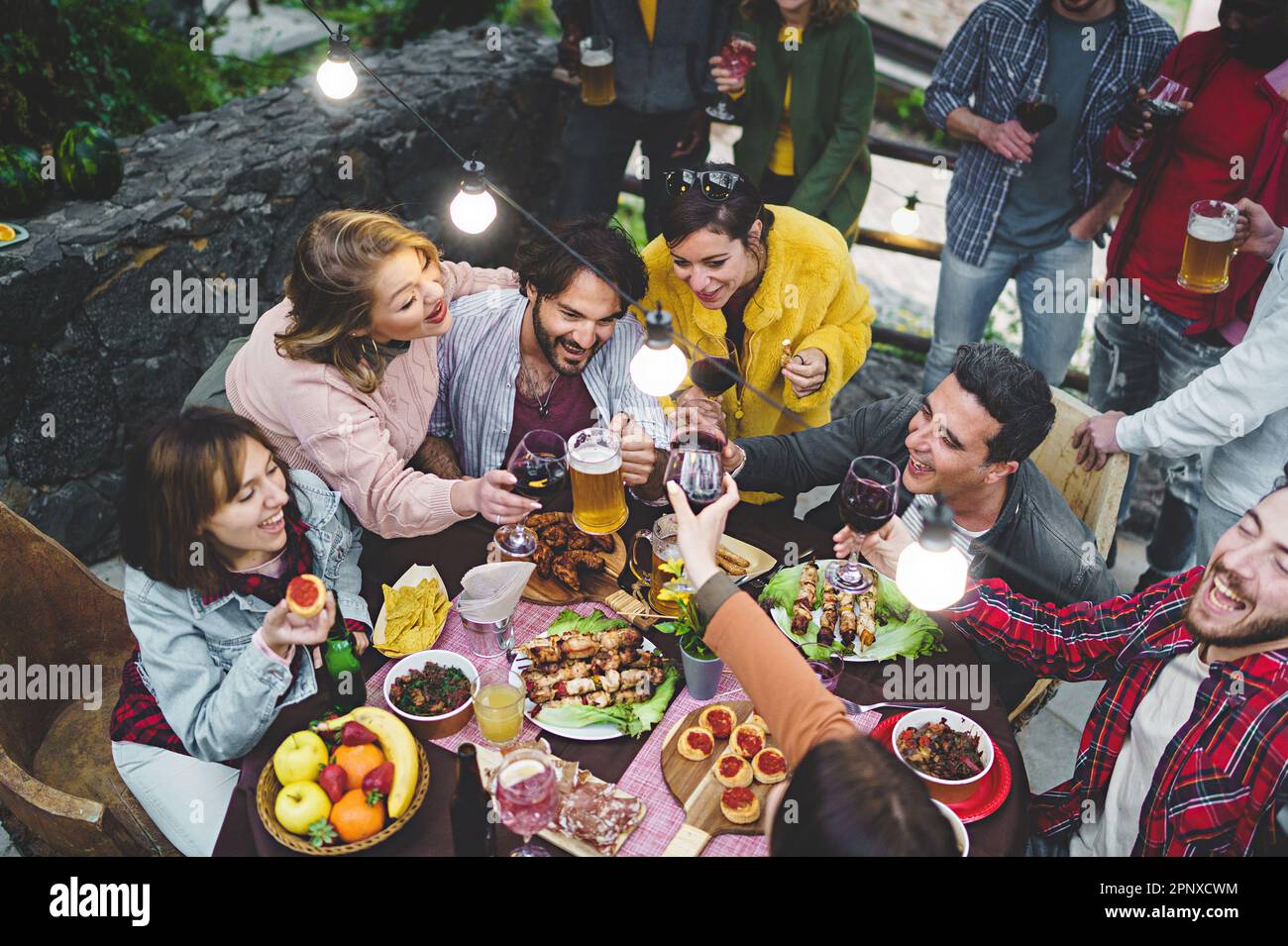 Aerial view of a diverse group of friends enjoying a sunny outdoor ...