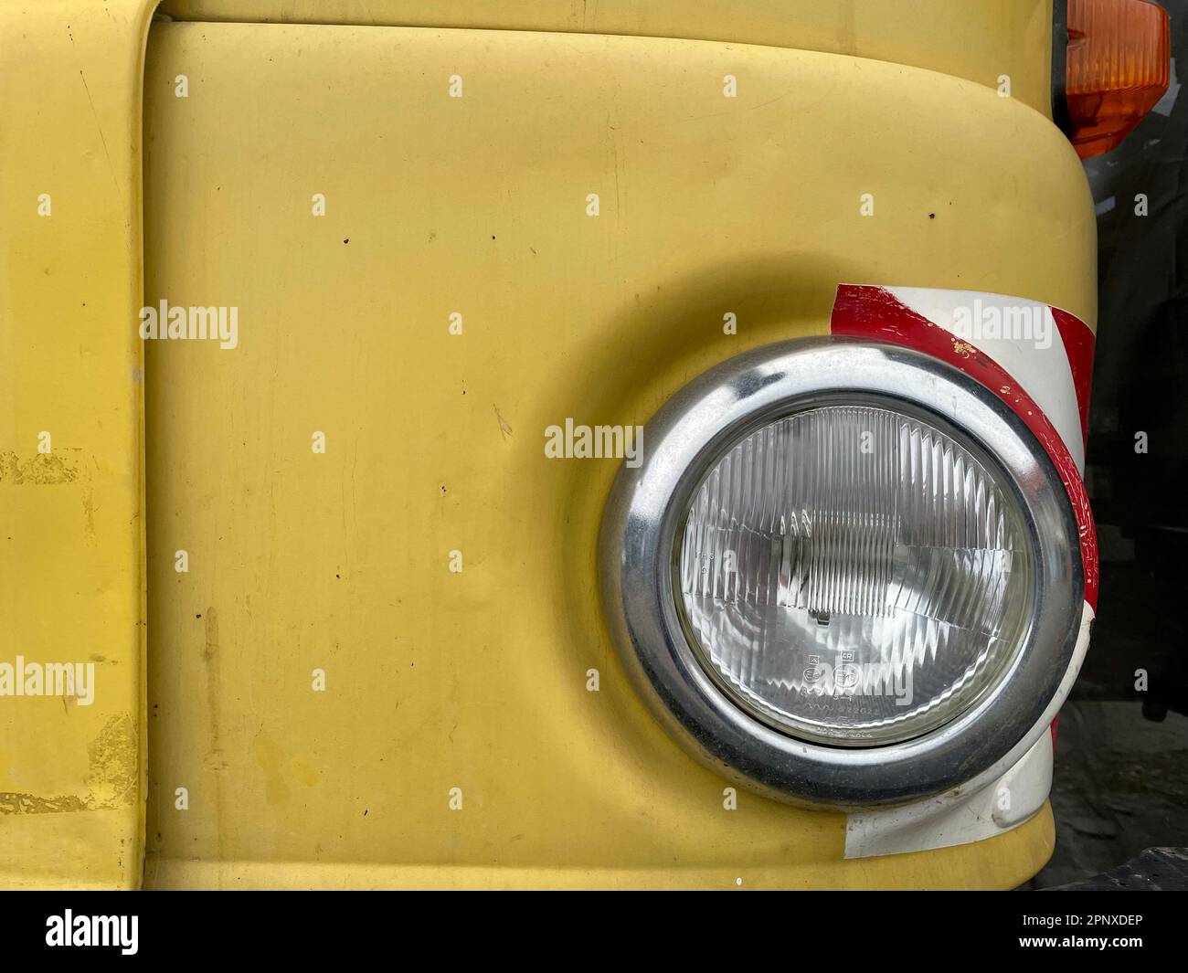 Detail of the round headlight of a yellow IFA W50 truck manufactured in ...