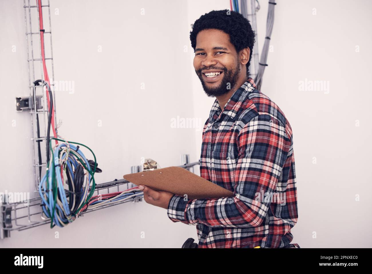 Cable inspection, portrait and a black man for maintenance, building ...
