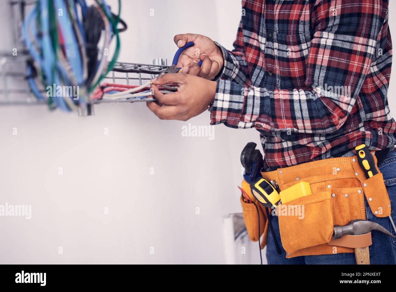 Electrician, technician and man with tool for cable maintenance ...