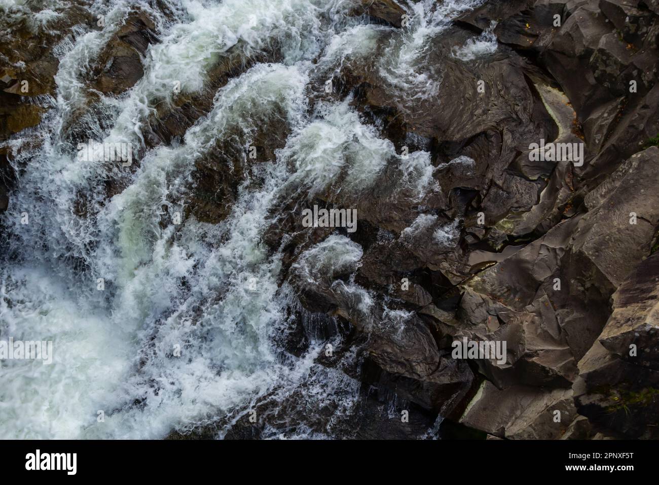 Close-up abstract texture above view of river torrent and clear fresh ...