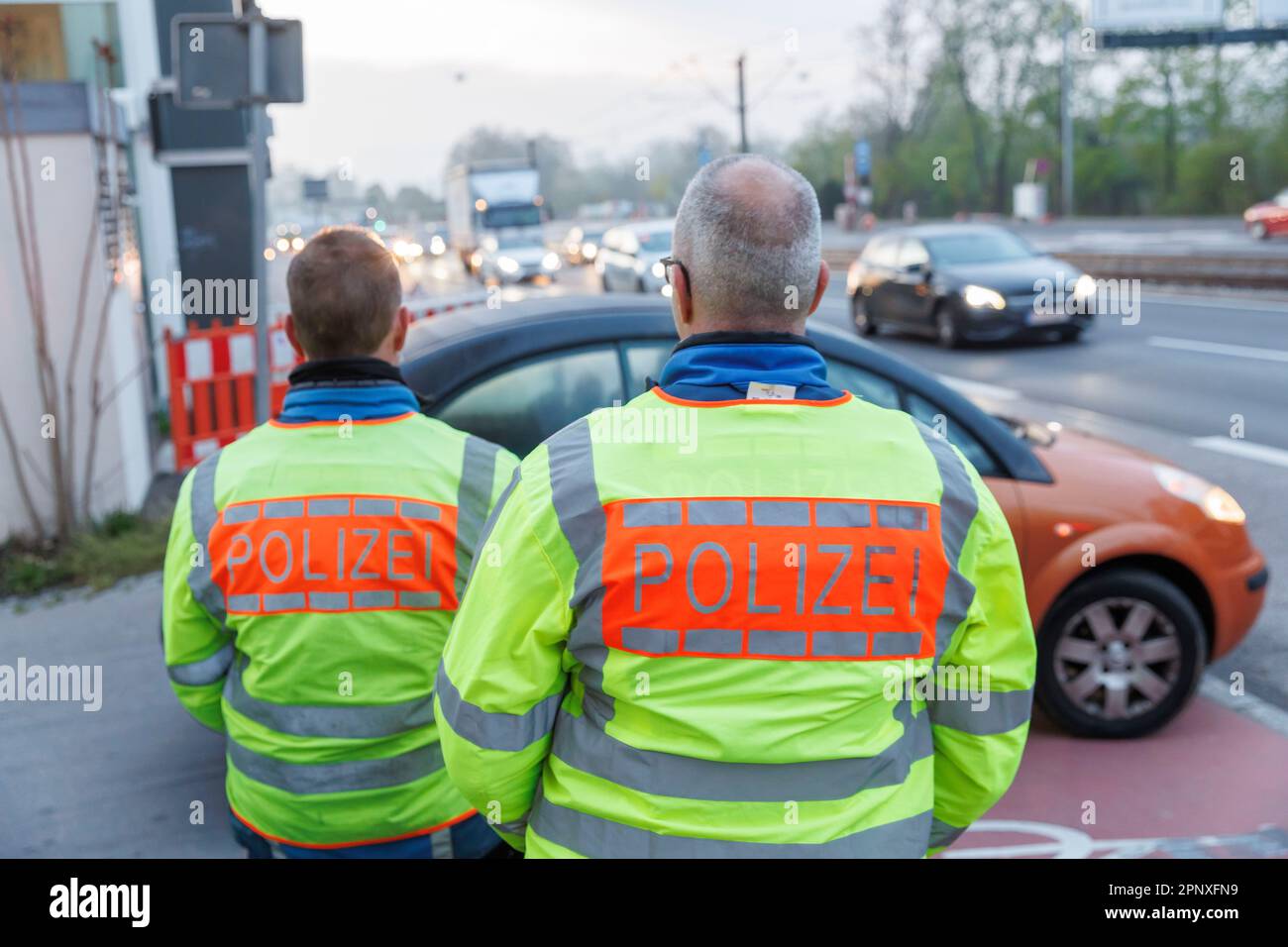 Stuttgart, Germany. 21st Apr, 2023. Two police officers wait at the ...