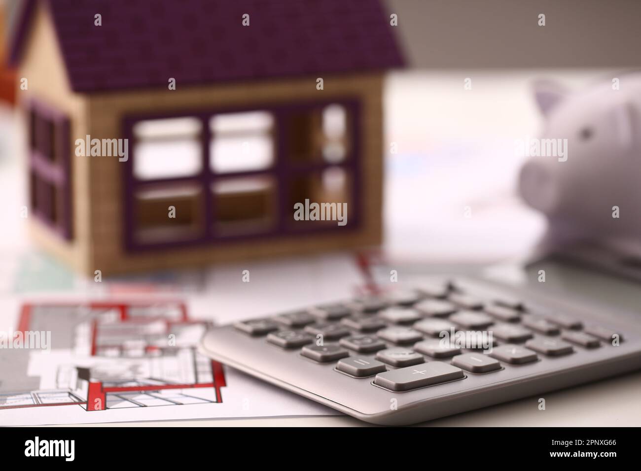 Architectural house plan house layout and calculator on table Stock ...