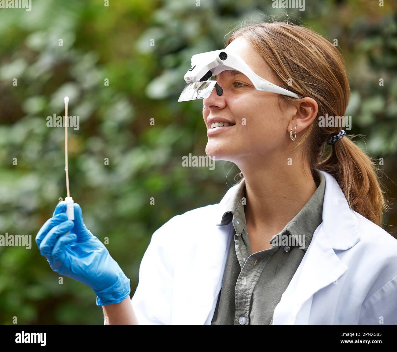 Science, nature and woman with sample with glasses for inspection ...
