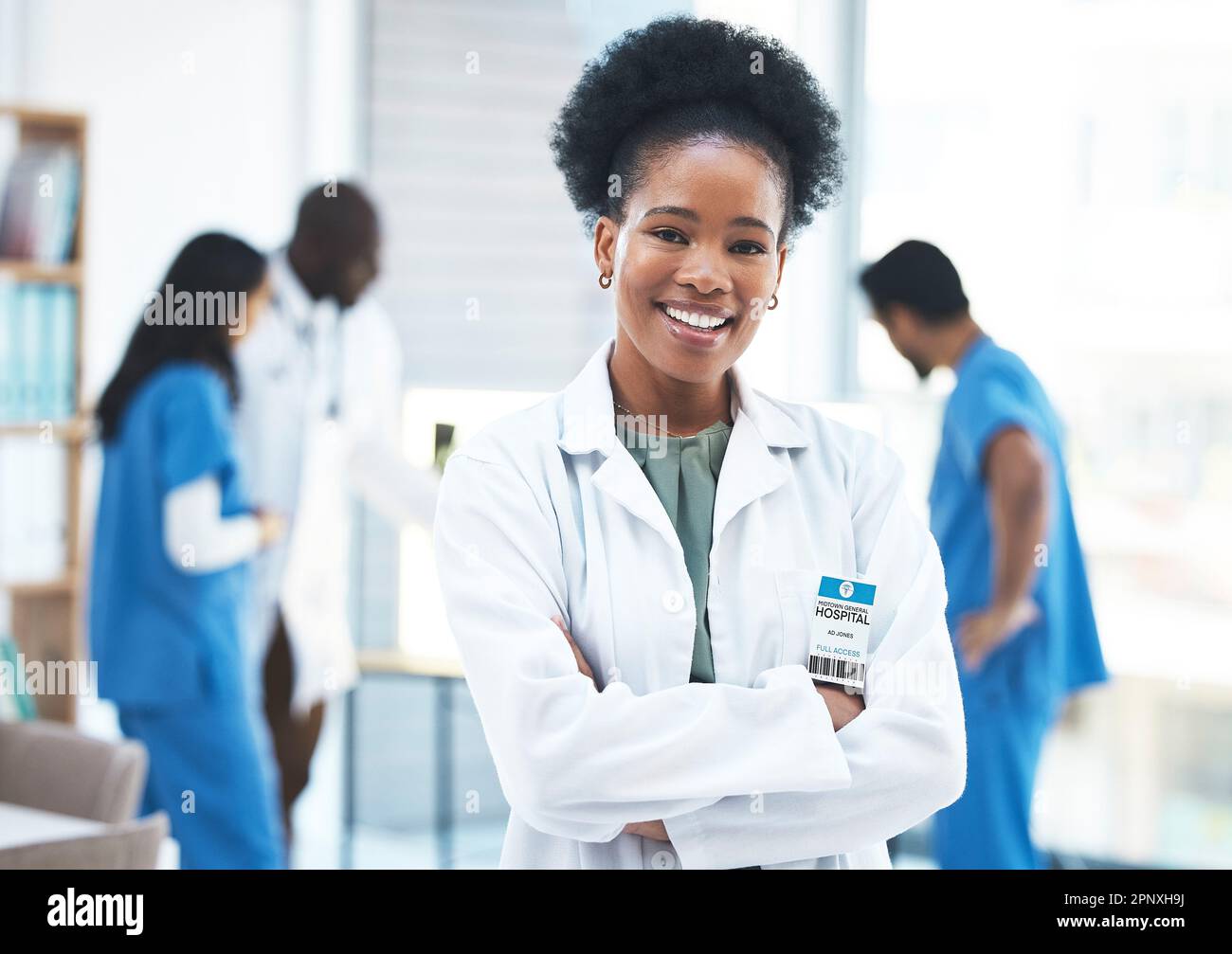 Black woman, doctor leader and arms crossed in portrait at clinic for ...