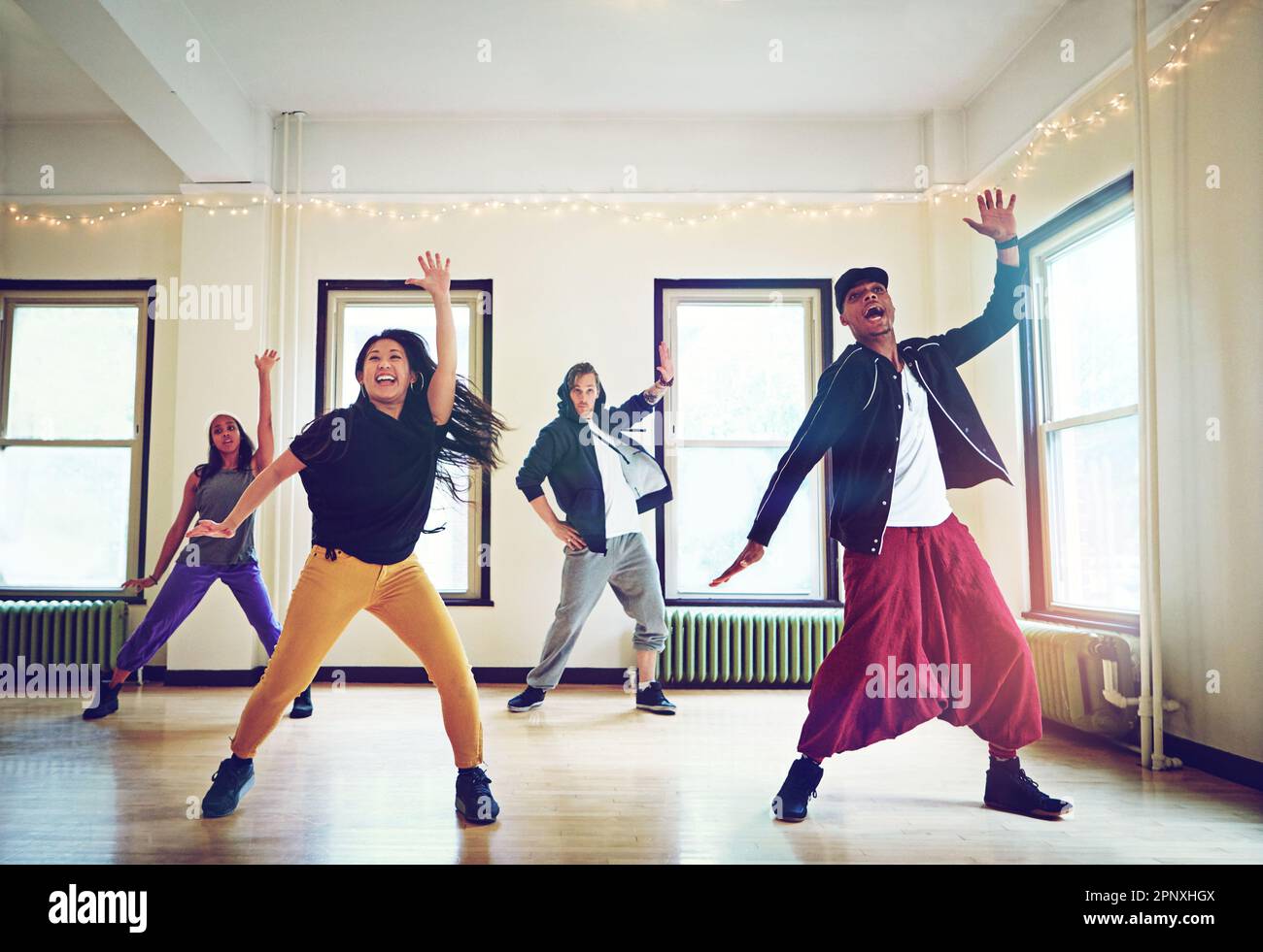 Taking their talent to the studio. a group of young people dancing ...