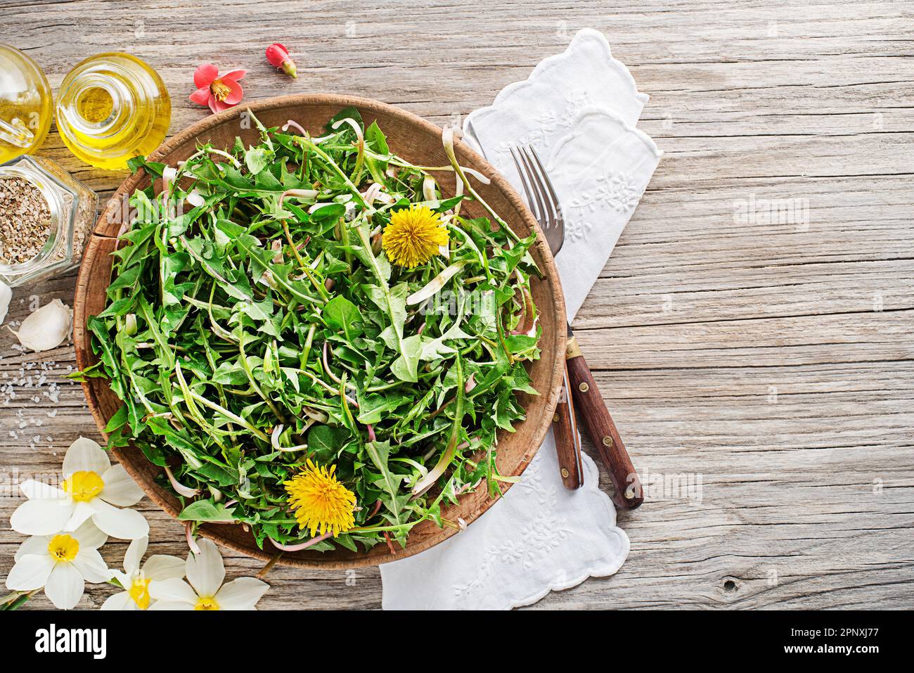 Fresh dandelion salad with dressing. Healthy spring food concept Stock ...