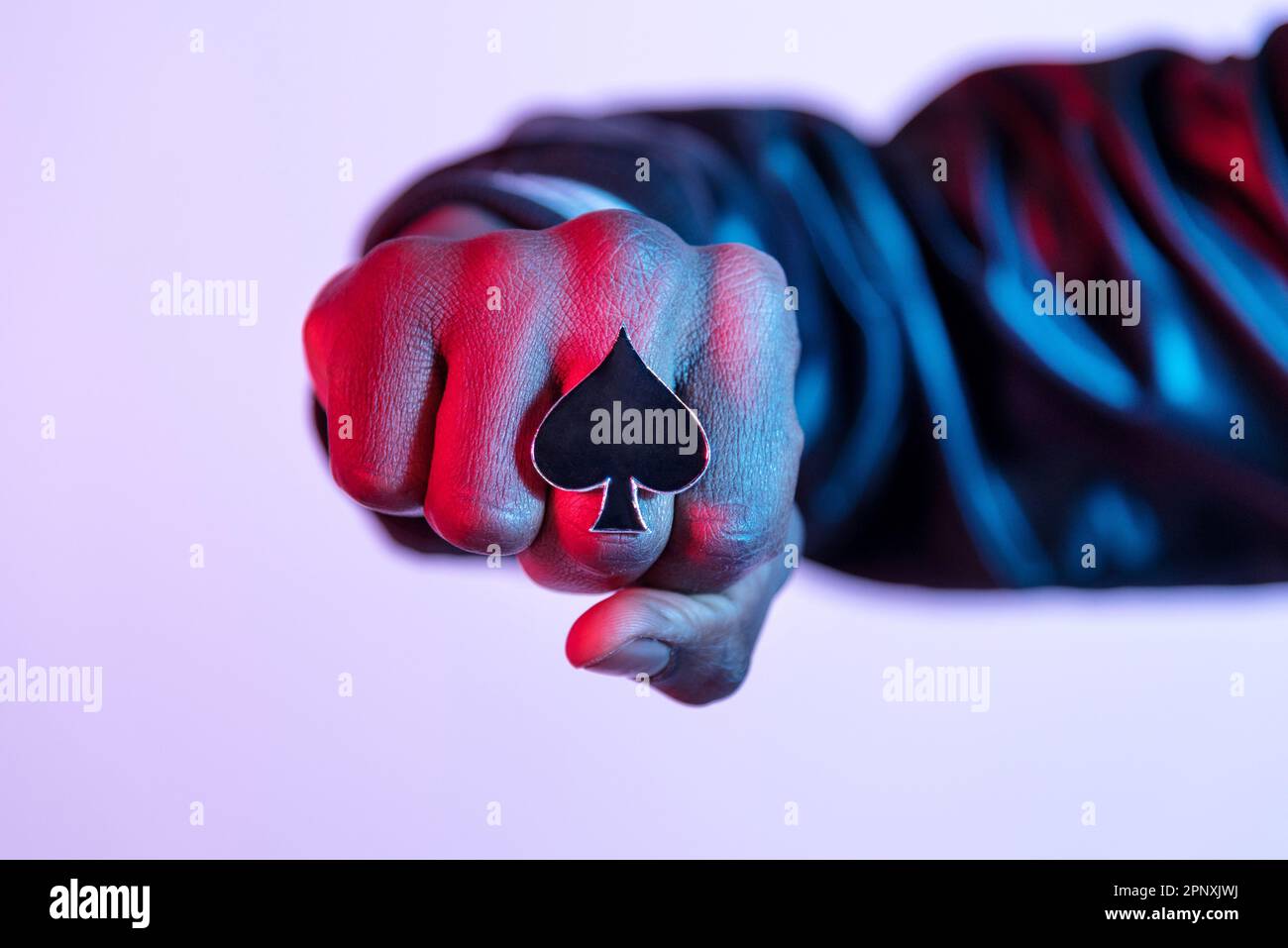 Young Black guy displaying his large ring with spades symbol balling ...