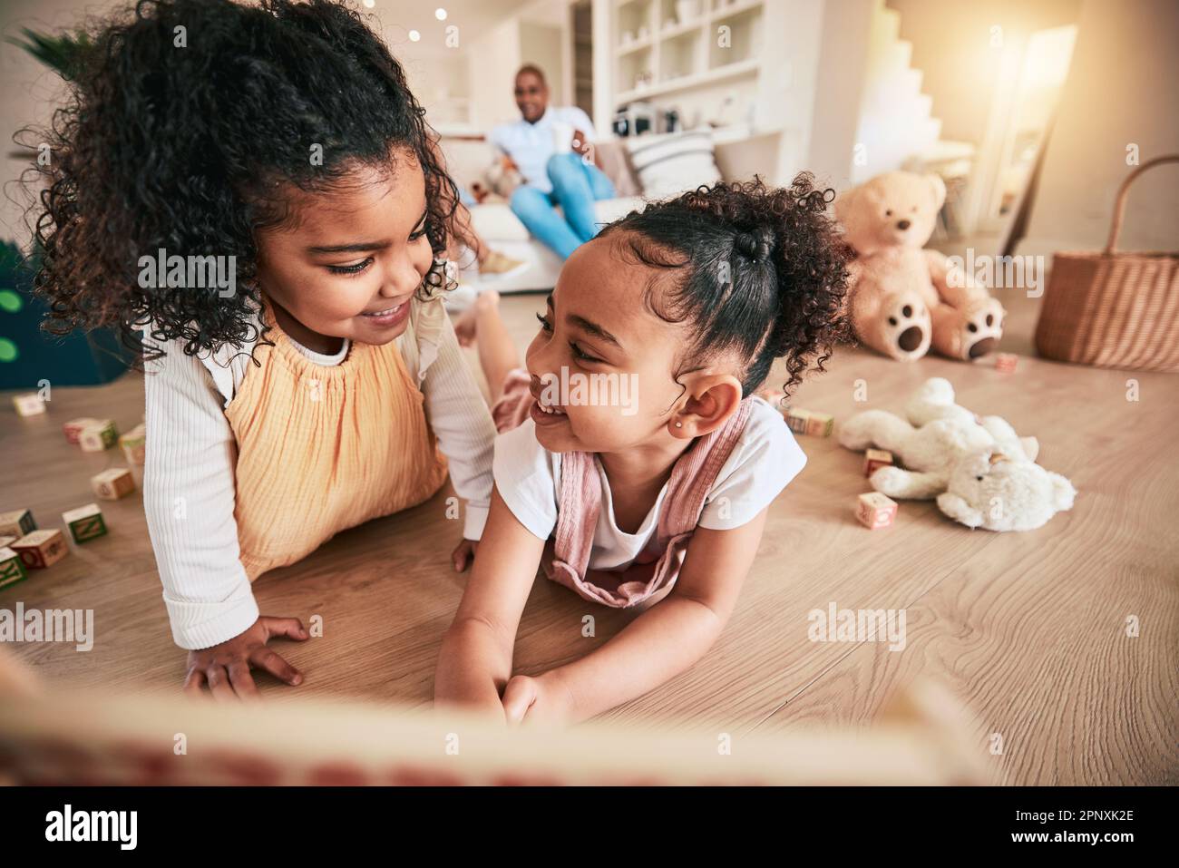Children, sister and best friends playing on the living room floor ...