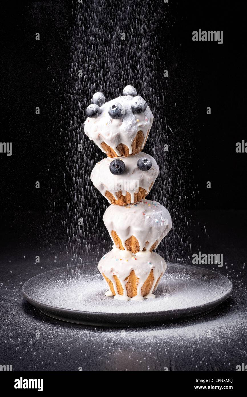 Stack of muffins close-up, black background. Homemade sweet pastries ...
