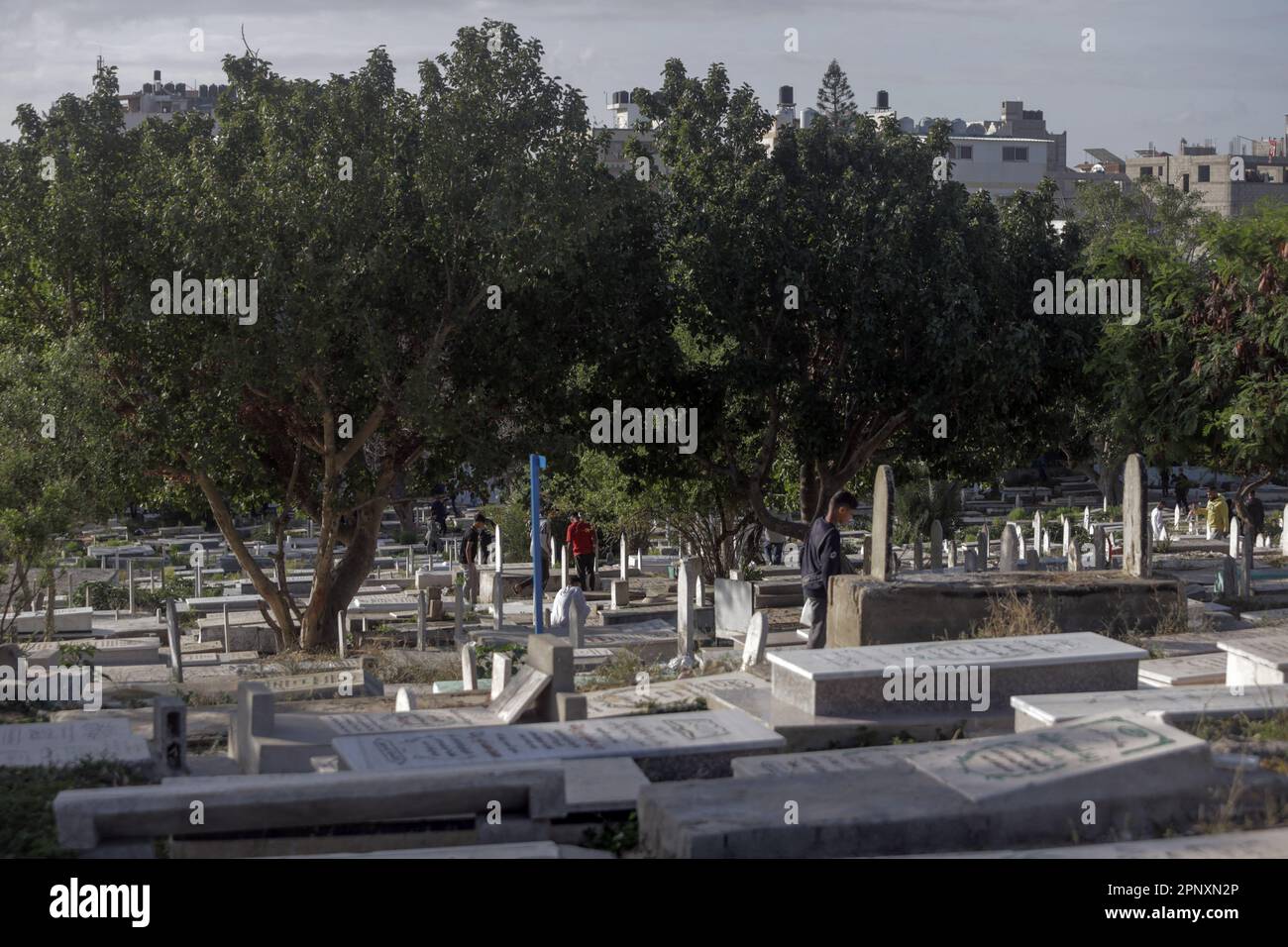 April 21, 2023, Gaza City, The Gaza Strip, Palestine: Palestinians at a nearby cemetery of ...