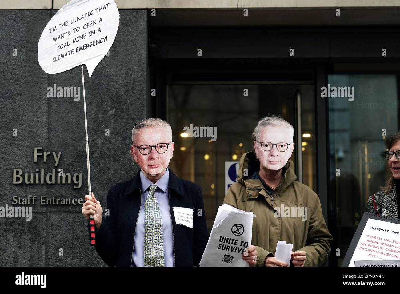 Extinction Rebellion demonstrators wearing Michael Gove face masks take ...