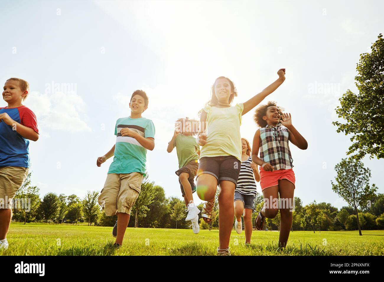 Almost at the finish line. a group of diverse and happy kids playing ...