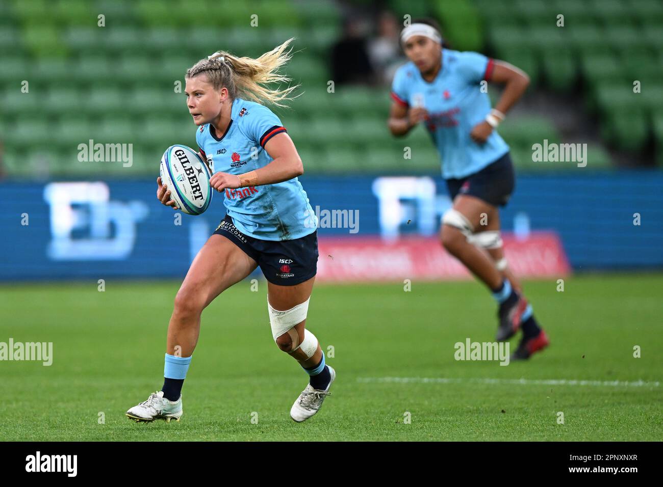Georgina Friedrichs of the Waratahs (left) in action during the Super W ...