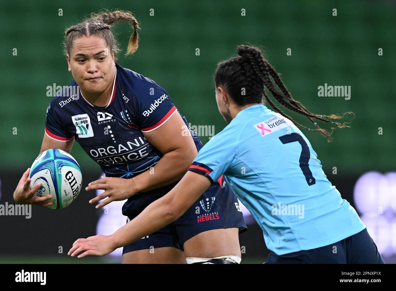 Ashley Marsters of the Rebels (left) in action during the Super W Round ...