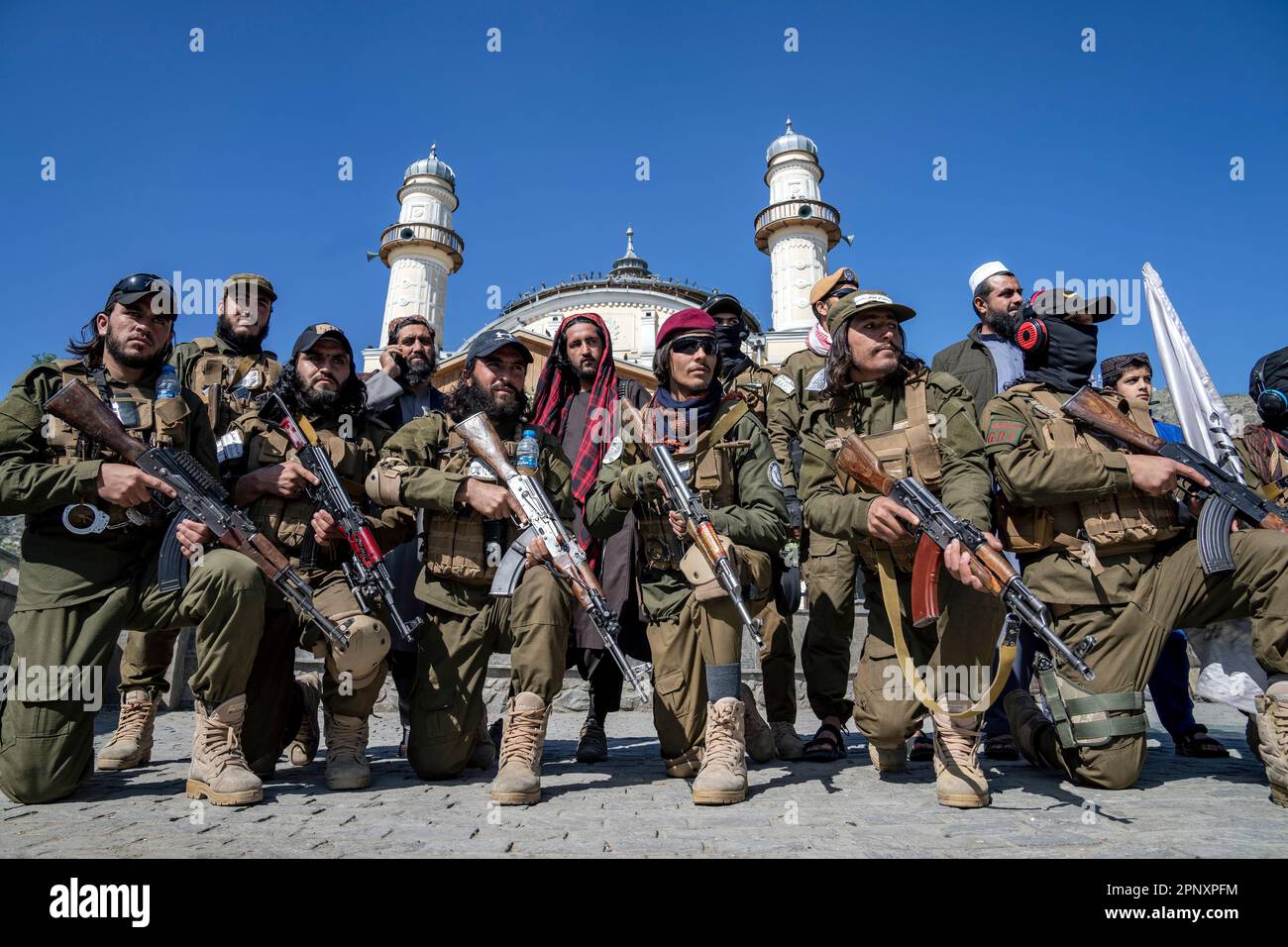 Taliban fighters pose for a photo after the Eid al-Fitr prayers ...