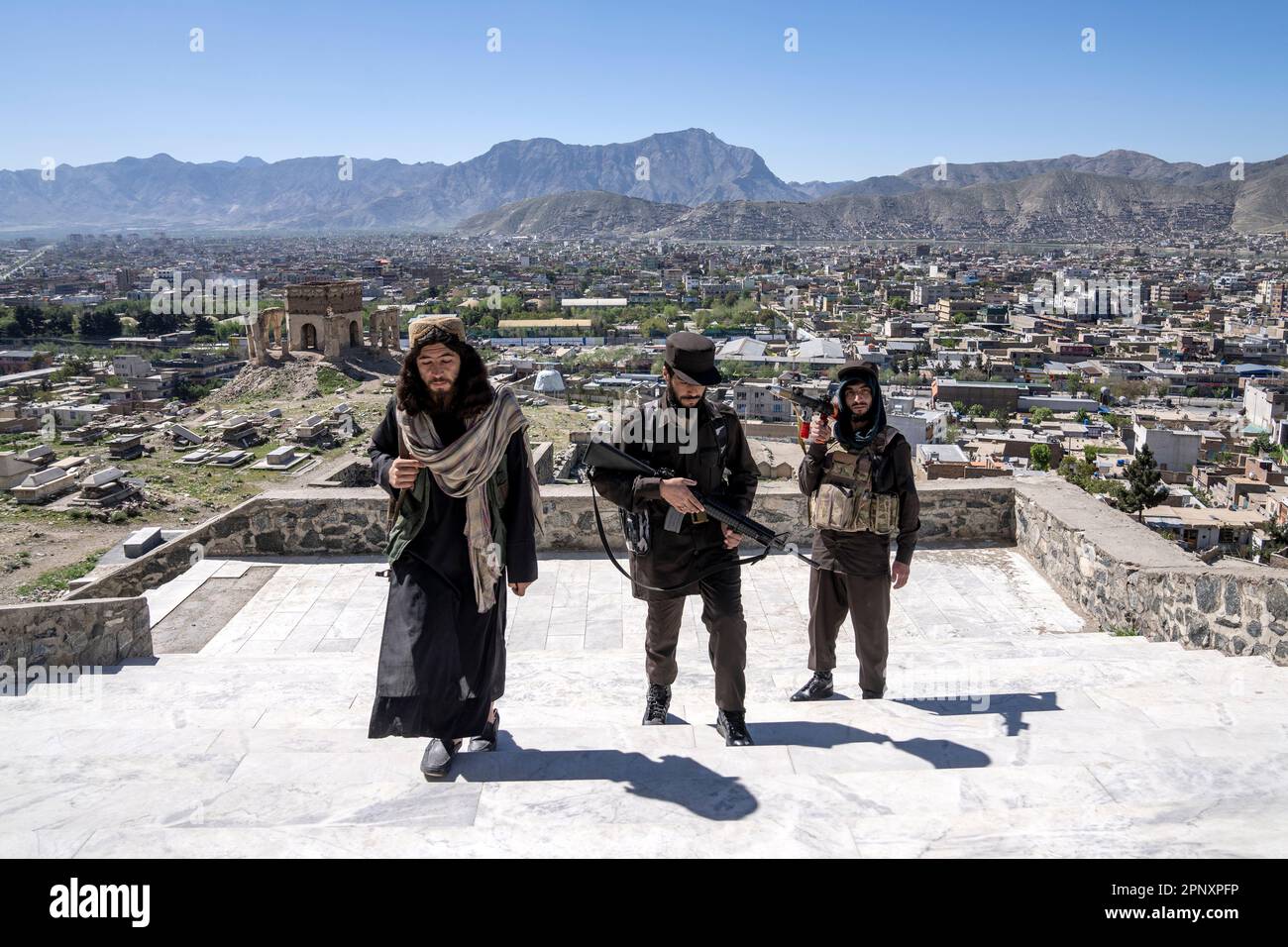 Taliban fighters stand guard on Nadir Khan hill, during the first day ...