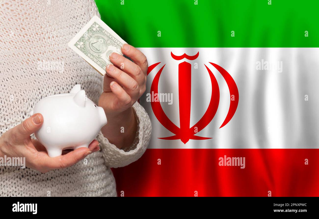 Irani woman with money bank on the background of Iran flag. Dotations ...