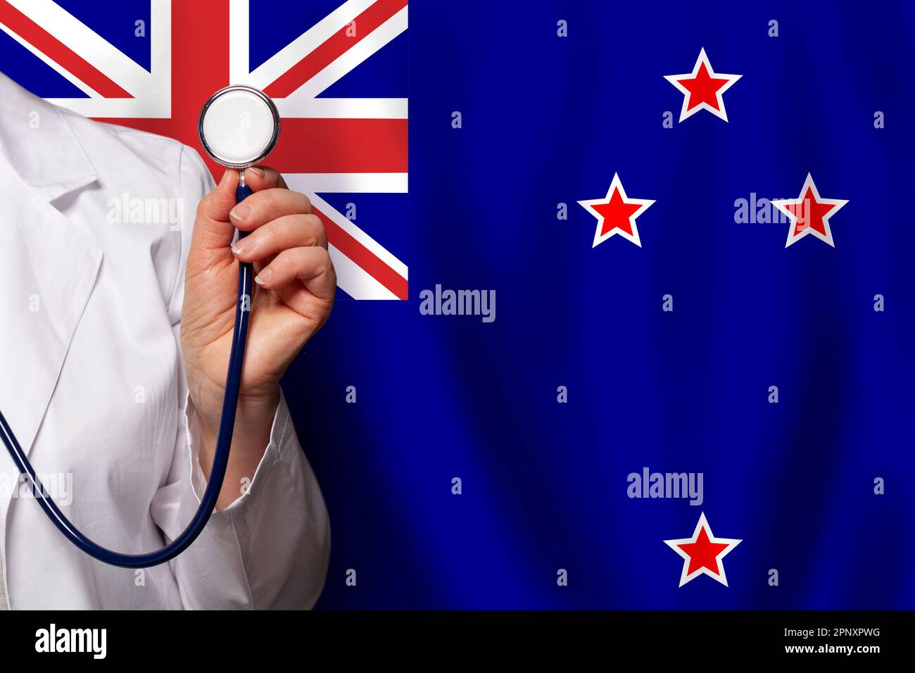New Zealand doctor's hand with stethoscope on the background of flag of ...