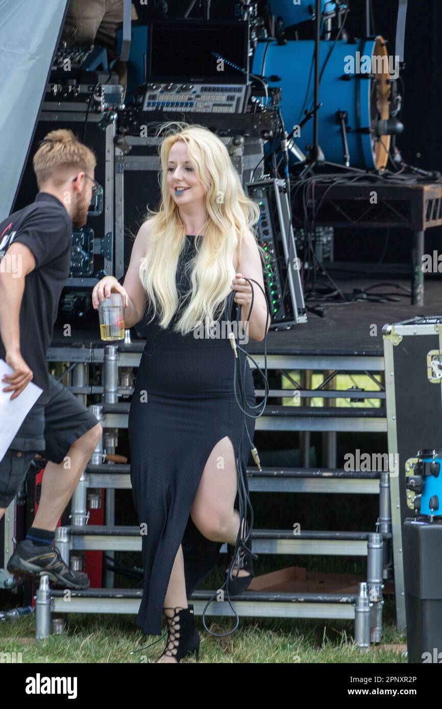 Alternative singer songwriter Hannah Rose Platt coming off stage with a ...