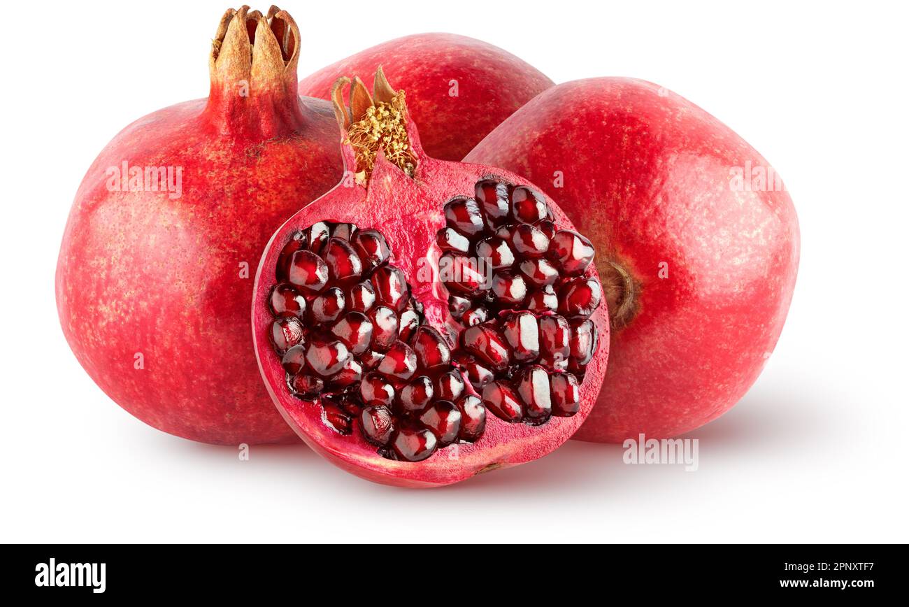 Isolated group of pomegranate. Three whole pomegranate fruit and half ...
