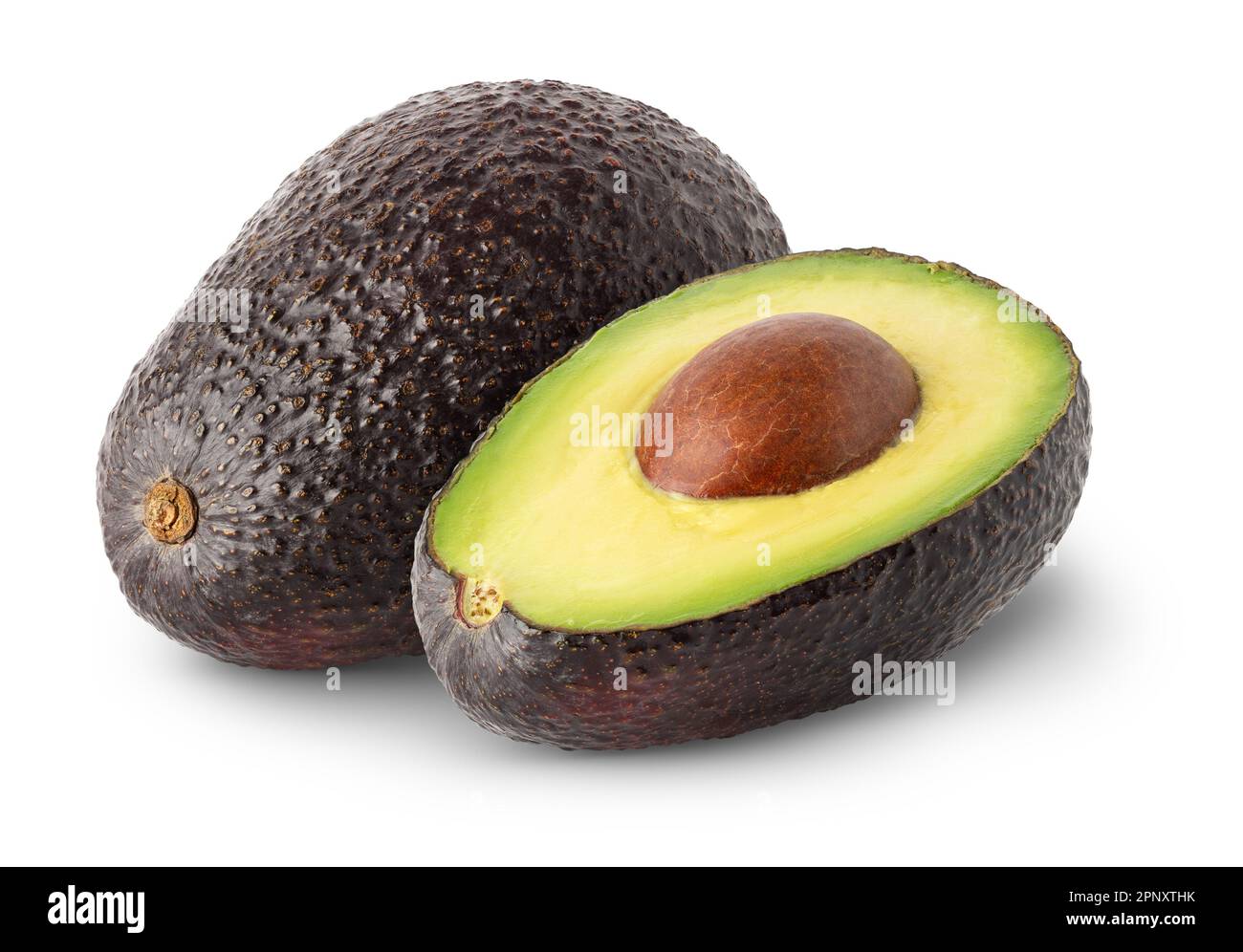 Isolated avocados. One and a half of black avocado fruits isolated on ...