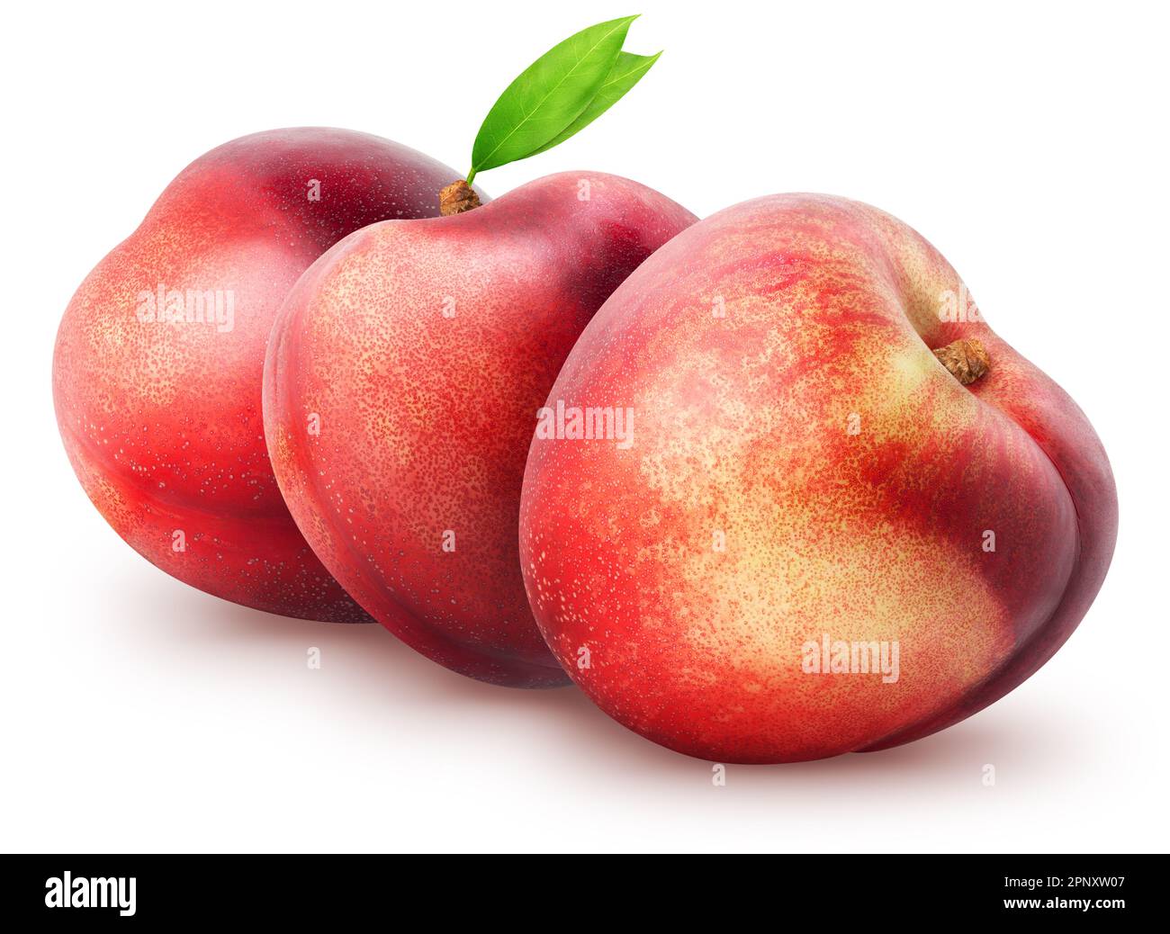 Three whole nectarine fruits with leaves isolated on white background ...