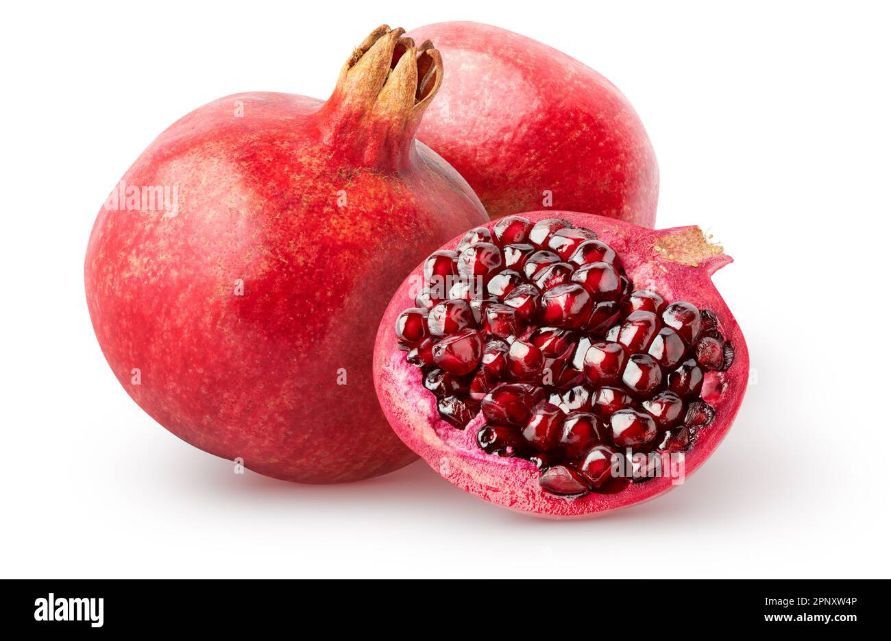 Isolated pomegranates. Two whole of pomegranate fruit and piece ...
