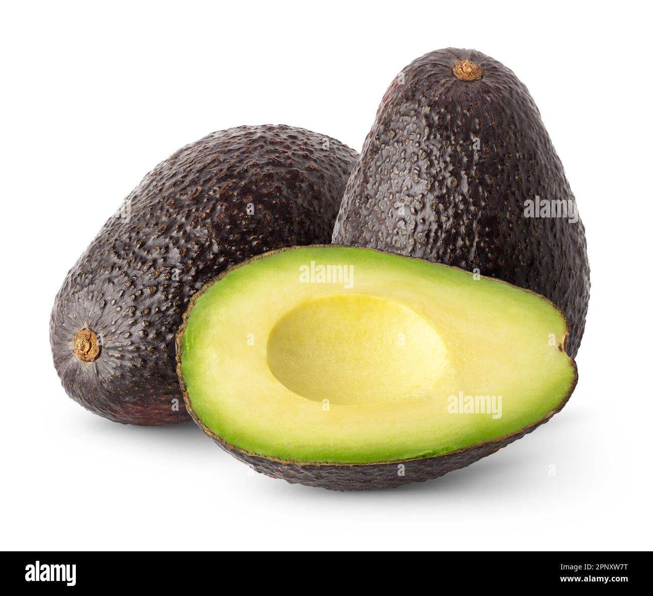 Isolated avocado. Two whole and cut in half avocado fruits isolated on ...