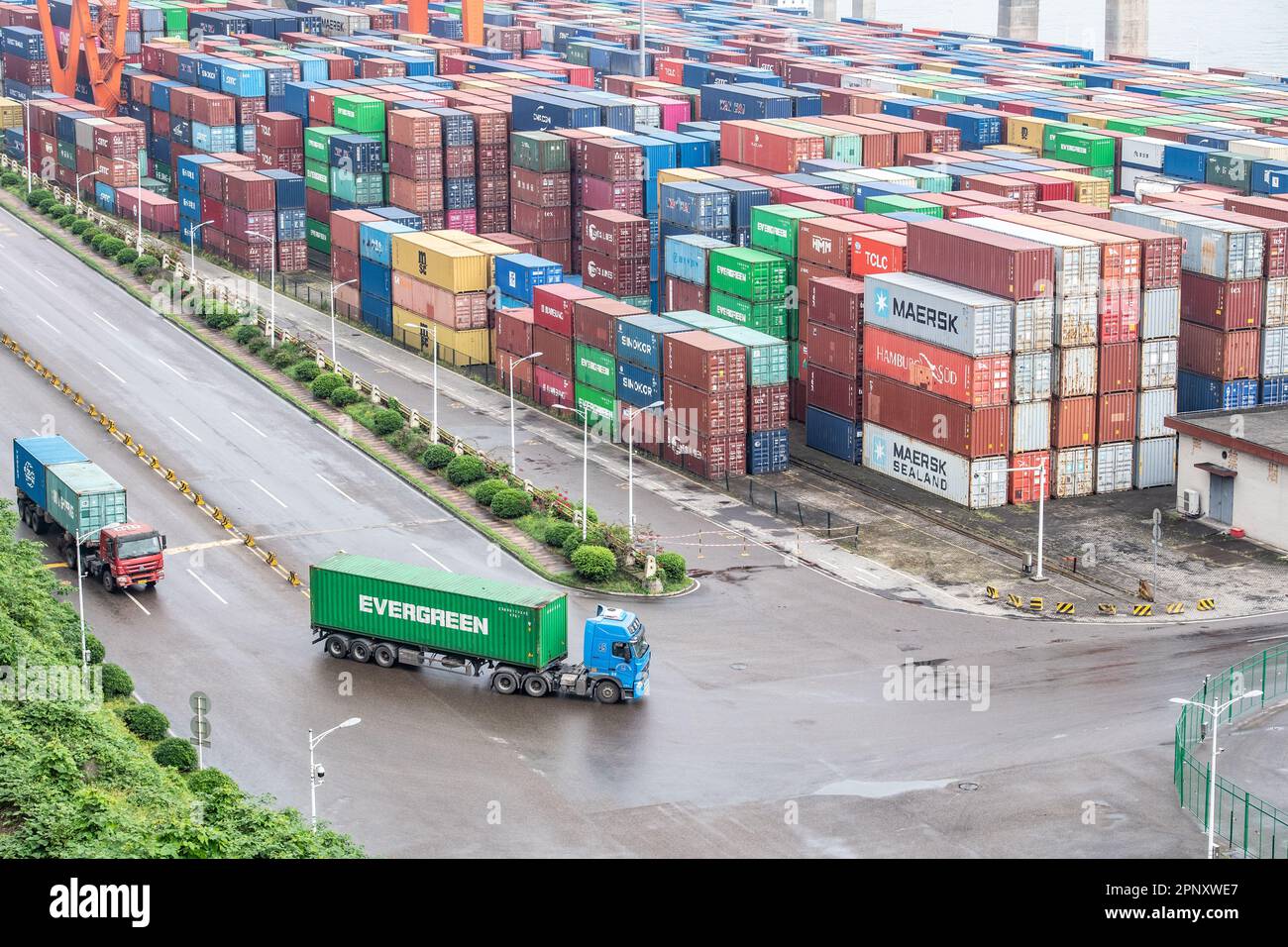 Chongqing. 20th Apr, 2023. Containers are transported by trucks at ...