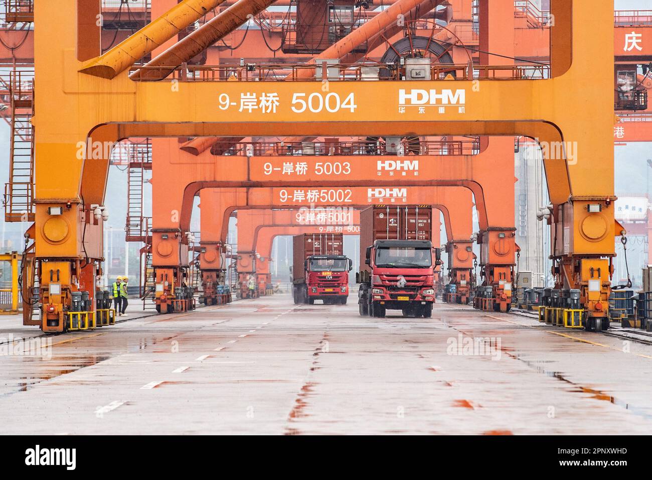 Chongqing. 20th Apr, 2023. Containers are transported by trucks at ...