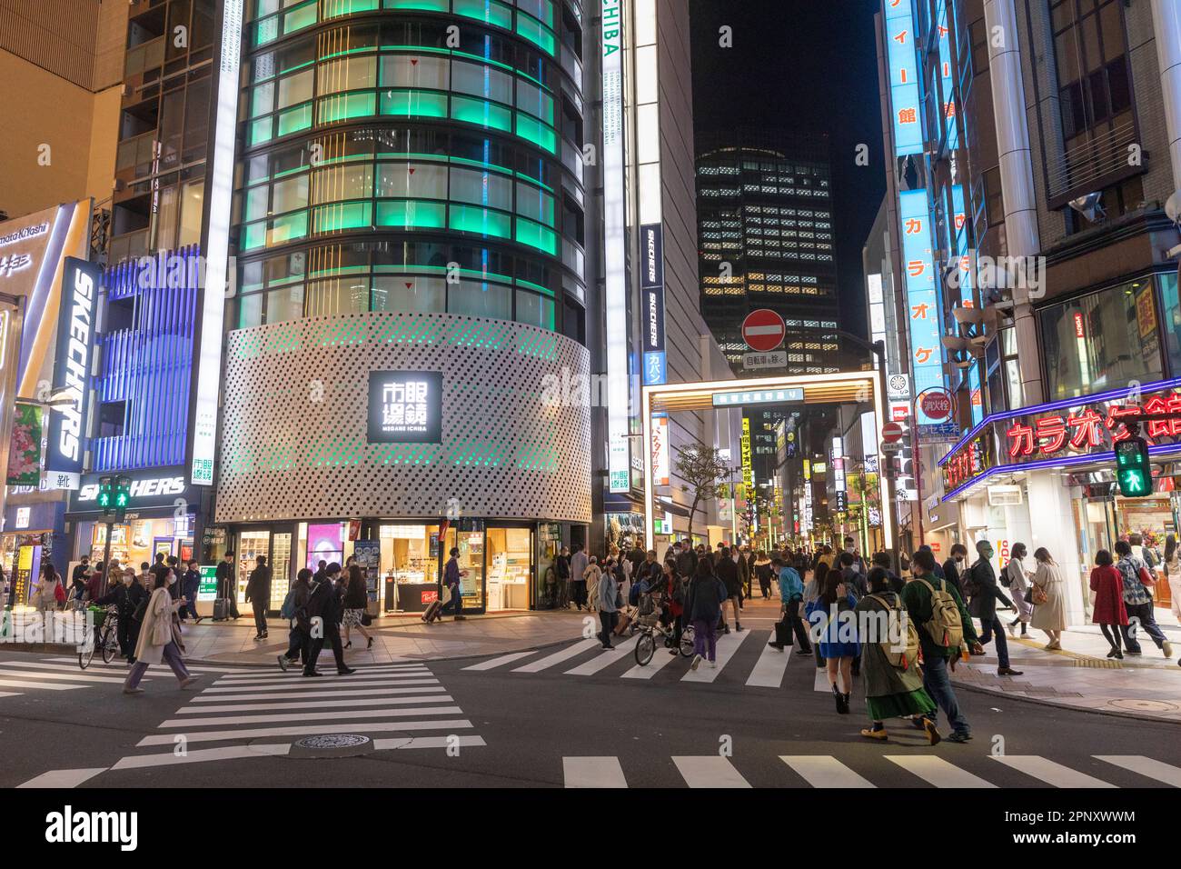 April 2023 Shinjuku Tokyo evening time and crowds and neon lights keep ...