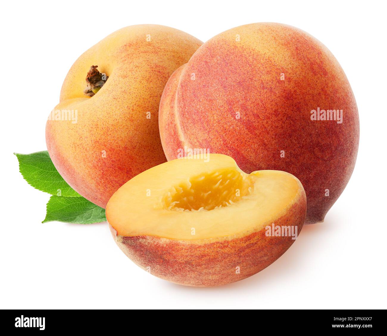 Peach isolated. Two whole peach fruits with piece and leaves isolated ...