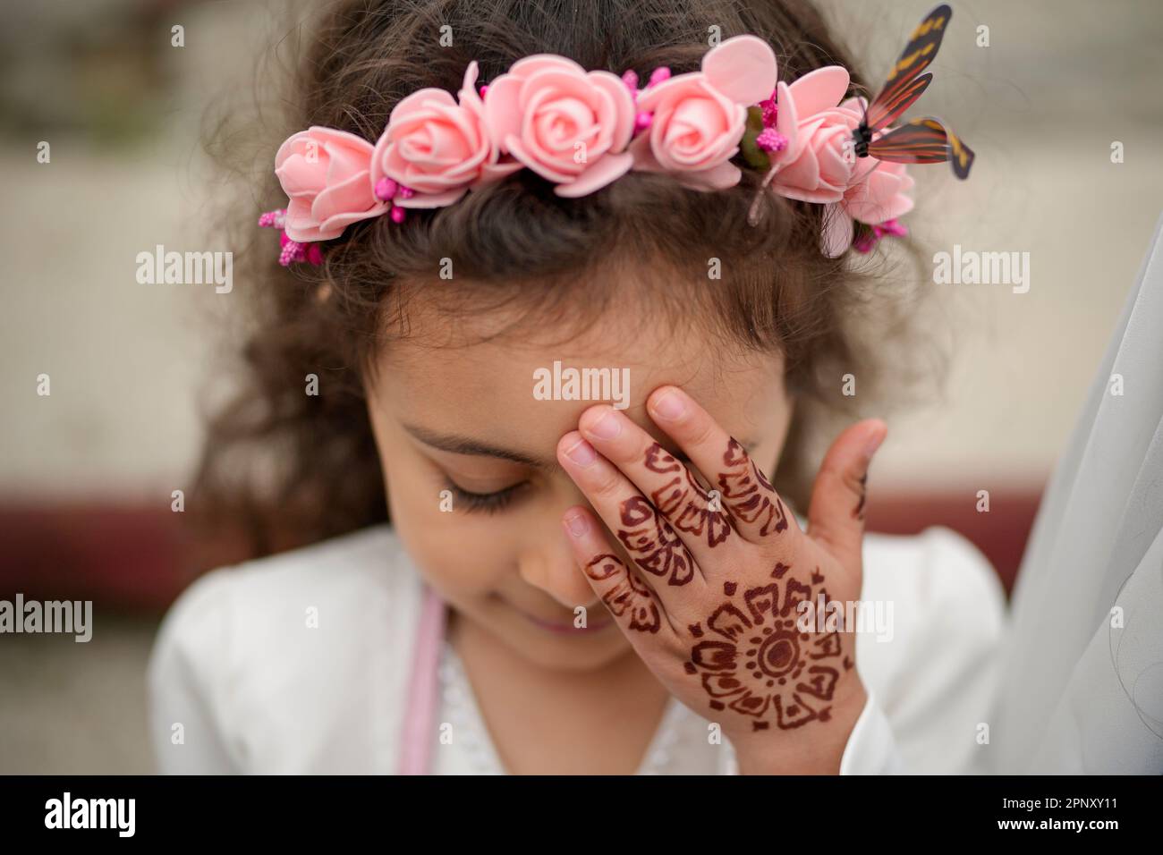 Hafsa Ahmed, 2 years-old, wipes her eye after Eid Al-Fitr prayers in ...
