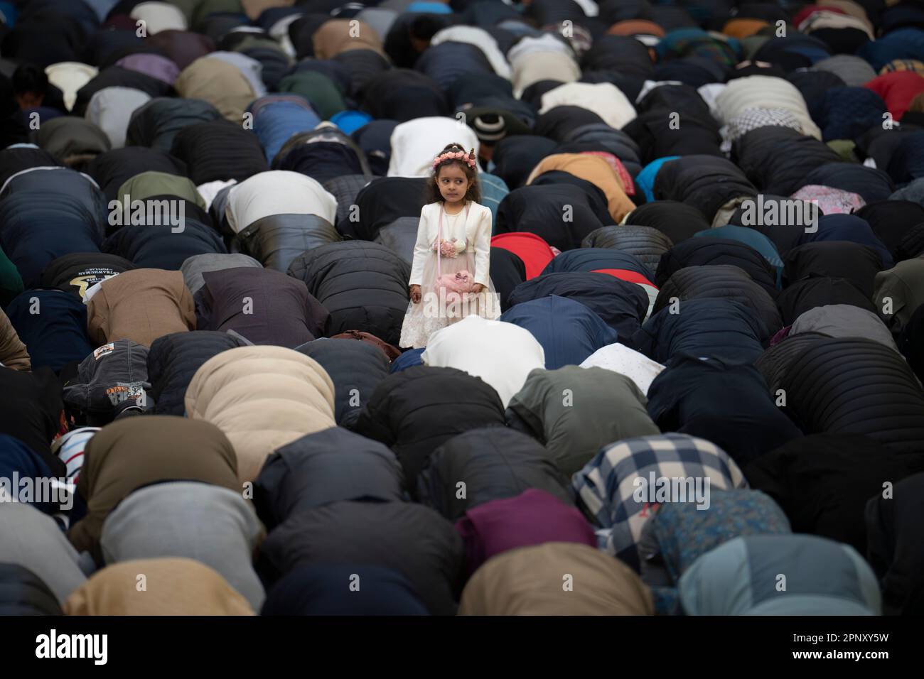 Hafsa Ahmed, 2 years-old, stands during Eid Al-Fitr prayers in ...